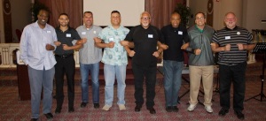 First Friday Huddles Locking Arms Men: